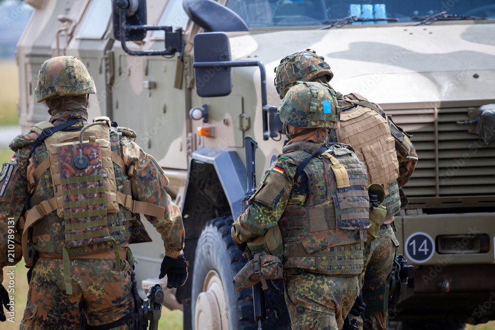 German soldiers stands near military vehicles on a open day on day of ...