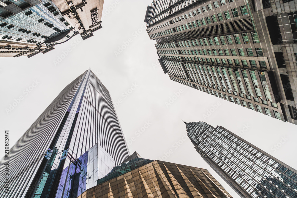 From below of skyscrapers under sky Stock Photo | Adobe Stock