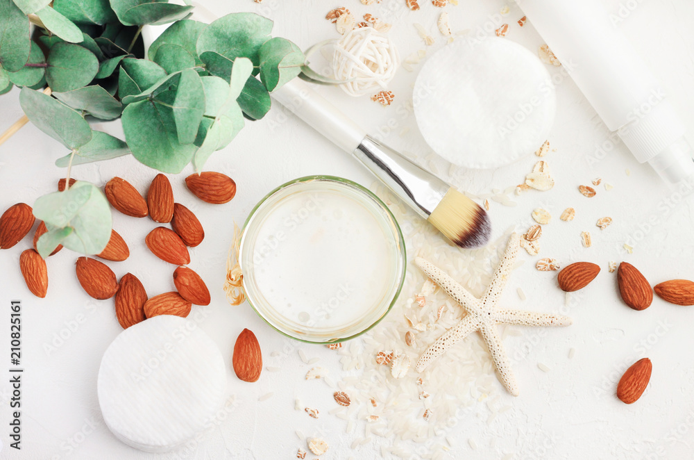 Top view white cosmetic product ingredients, homemade rice water and ...