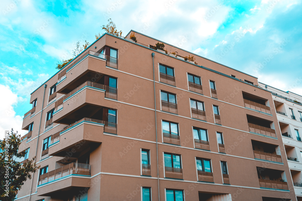brown apartment building with modern facade Stock Photo | Adobe Stock
