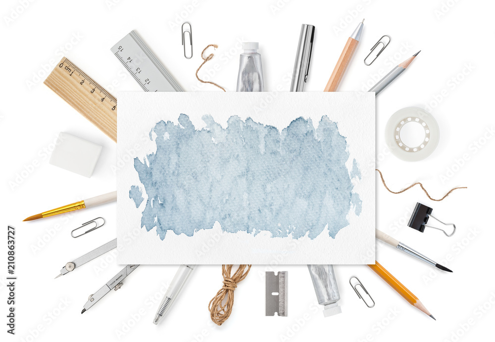 Sheet of paper A4 with stationery supplies on white. Front cover top ...