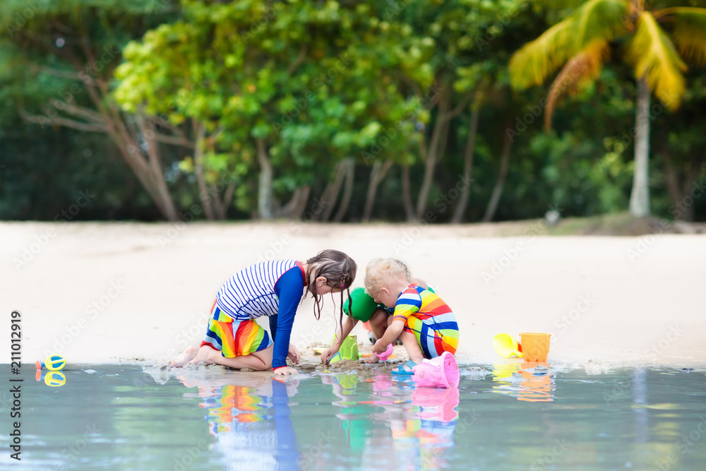 Kids on tropical beach. Children playing at sea. Stock Photo | Adobe Stock