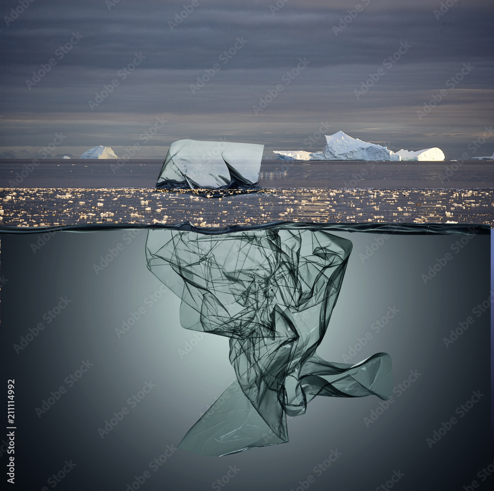 iceberg of garbage plastic floating in ocean with greenland background ...