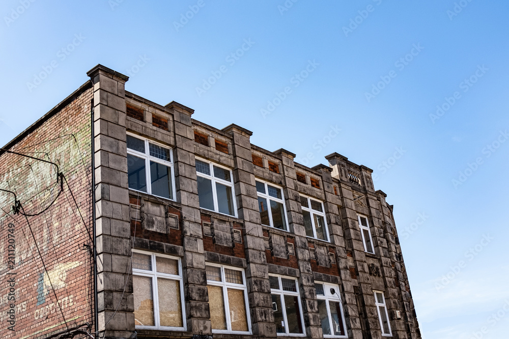 Abandoned run down brick built office building with turret top Stock ...