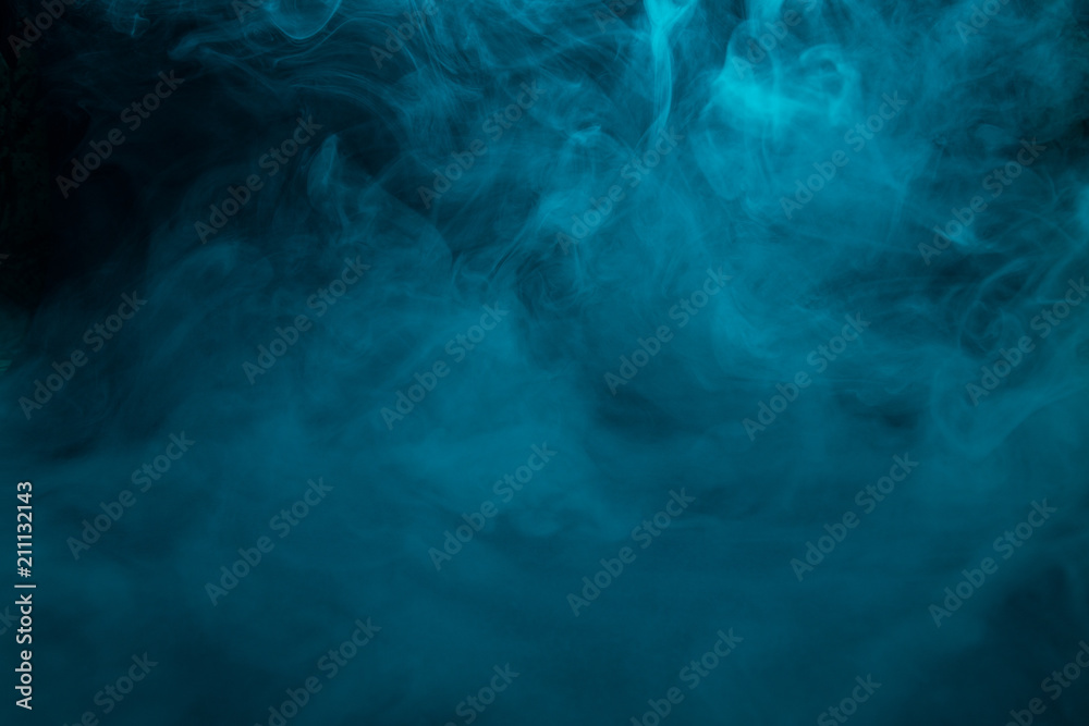 Colored turquoise smoke on a black background closeup Stock Photo ...