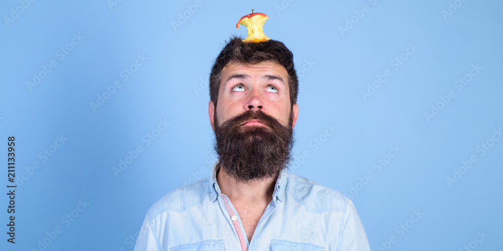 Live target concept. Man handsome hipster long beard almost eaten apple ...