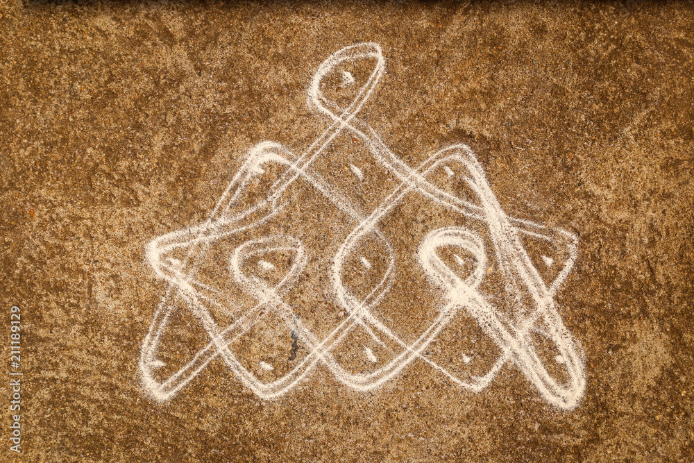 Indian traditional kolam or rangoli drawings on the floor, South India ...