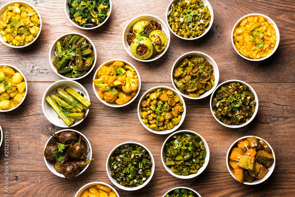 Indian sabzi / vegetable fried recipes served in white bowl over moody ...