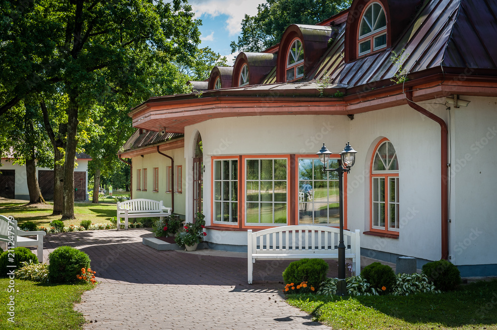One of the entrances to the manor in a beautiful summer day. Tourist ...