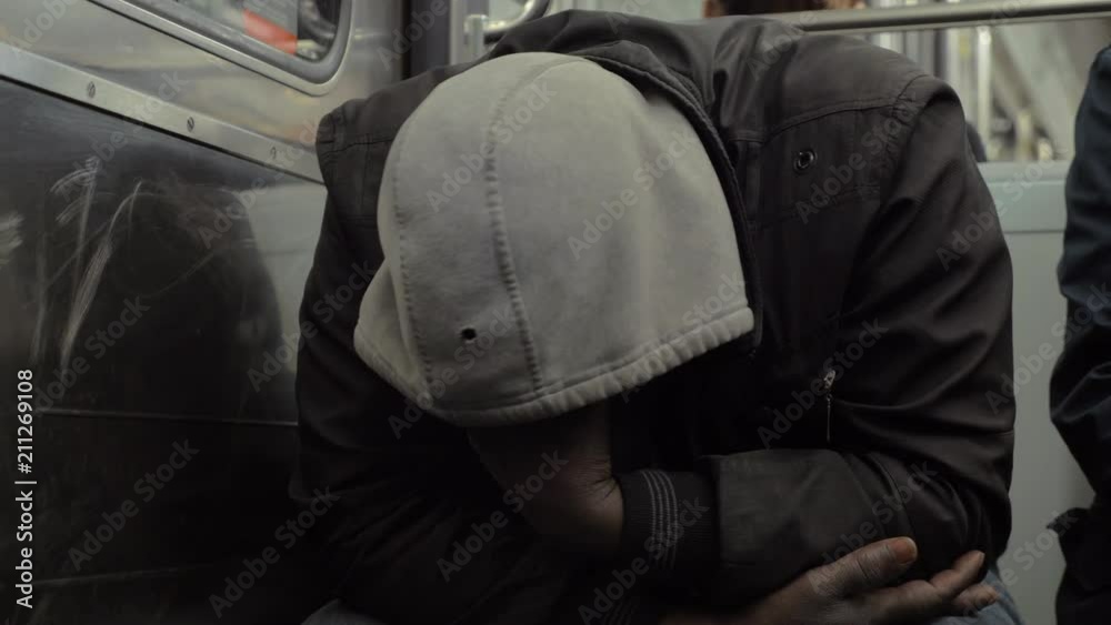 Vidéo Stock Slow motion shot of unidentified homeless man in shabby ...