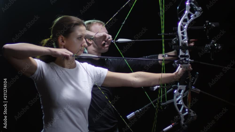 Vidéo Stock Studio shot with tilt up of concentrated female and male ...