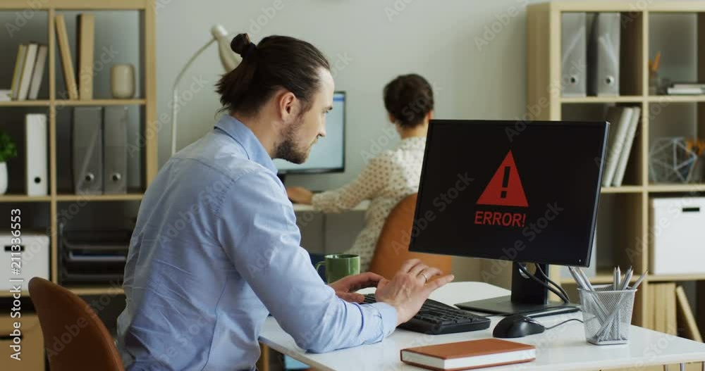 Vidéo Stock Rear of the male nervous Caucasian office worker typing and ...