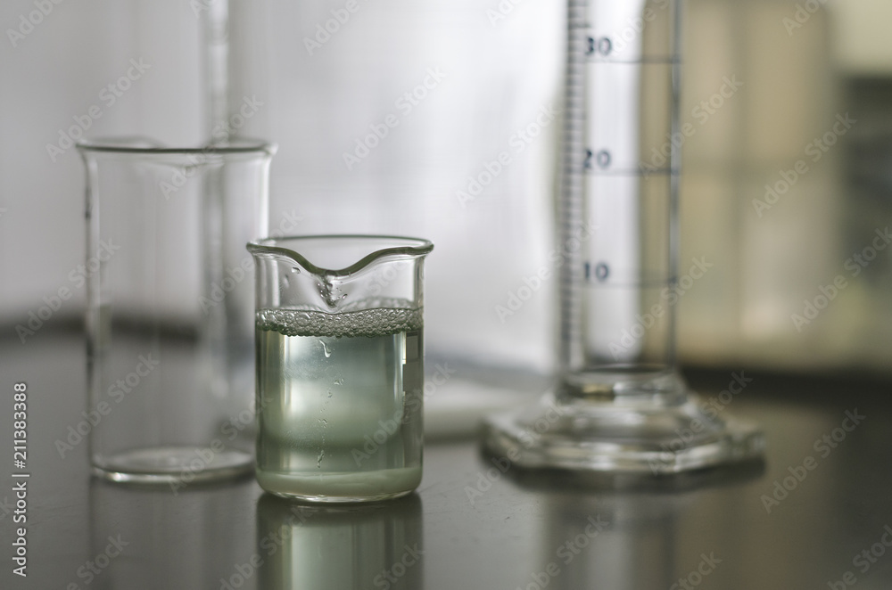 Sample of water in glass tube with green coloring gradient Stock Photo ...