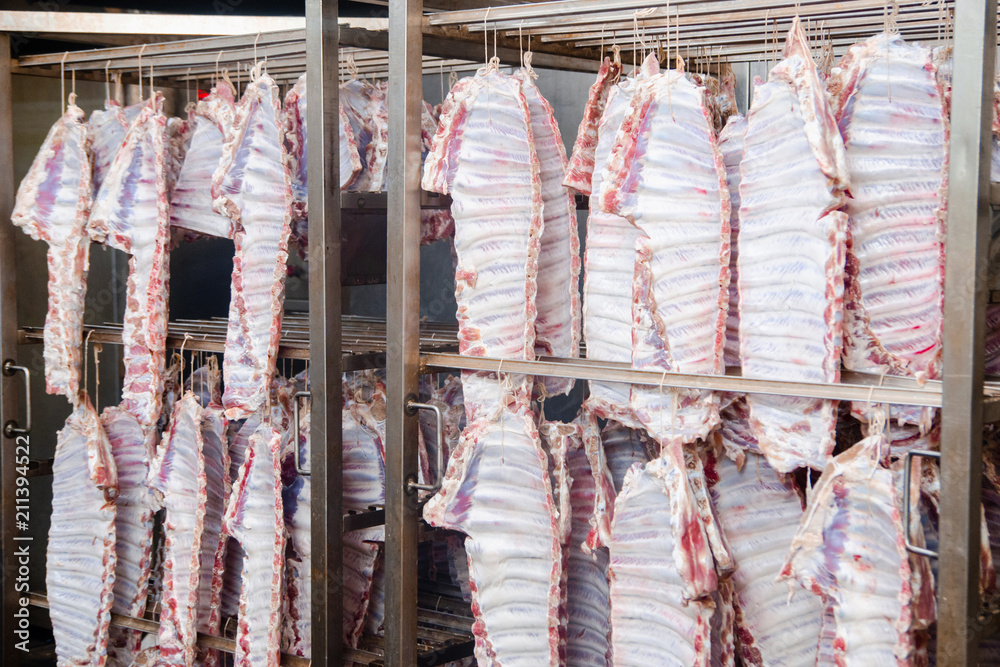 Pork. The line for the production of smoked delicacies. Industrial ...