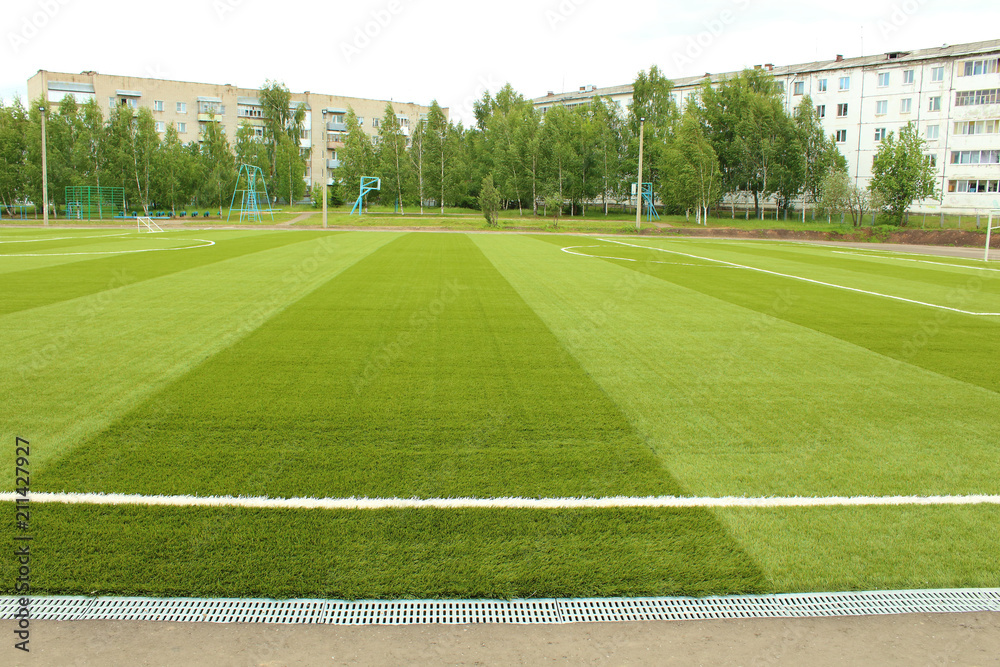 Artificial turf on the football field. Soccer field at the school ...