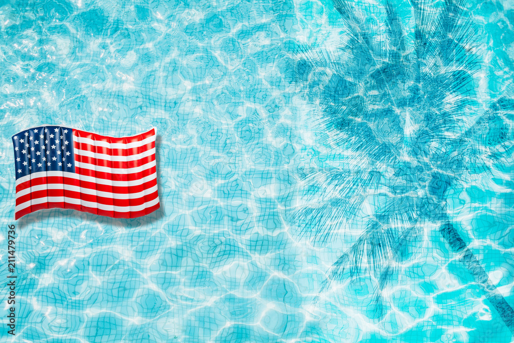 Pool float, ring floating in a refreshing blue swimming pool with palm ...