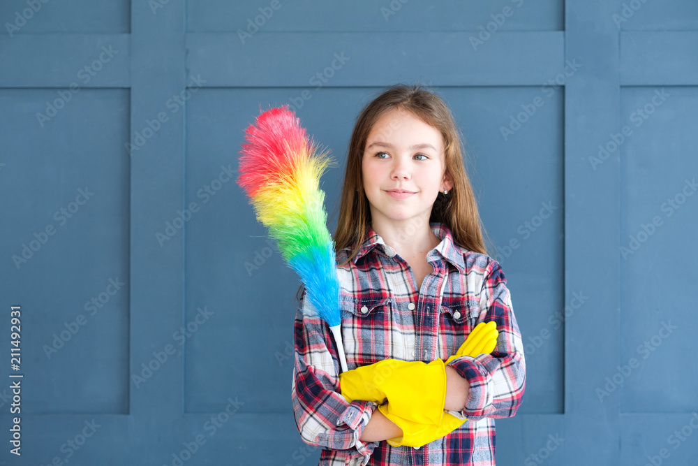 moms little helper. cute girl in yellow rubber gloves and with rainbow ...