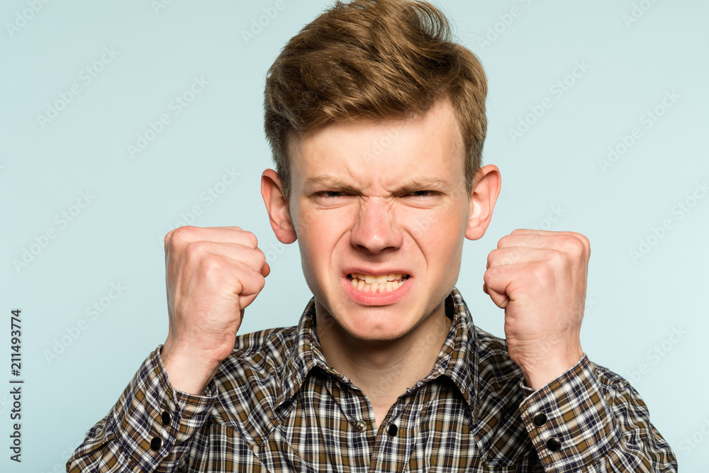 hate and desire to kill. man face distorted with anger. portrait of a ...