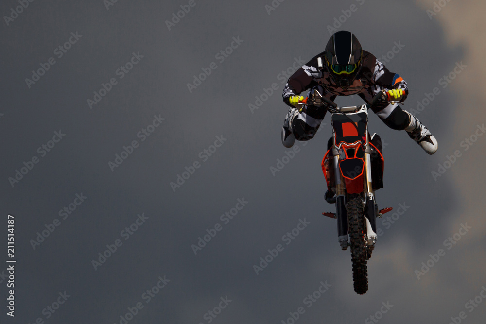 Professional rider at the FMX make an acrobatic jump at the motor show ...