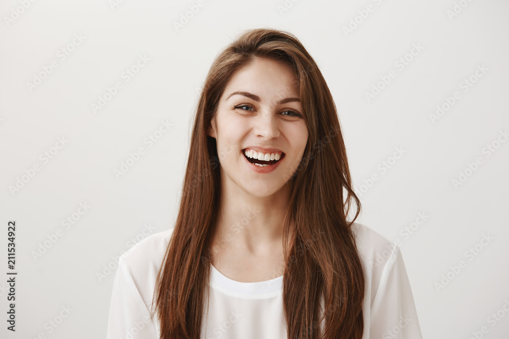 Smile makes people beautiful outside. Good-looking girlfriend laughing ...