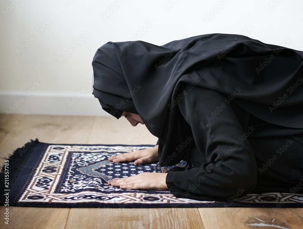 Muslim woman praying in Sujud posture Stock Photo | Adobe Stock