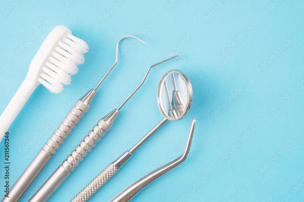 Dental tools use for dentist on the blue background, flat lay, top vipw ...