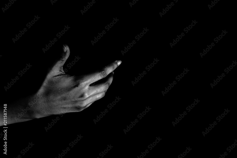 Hand Reaching Out Of Darkness