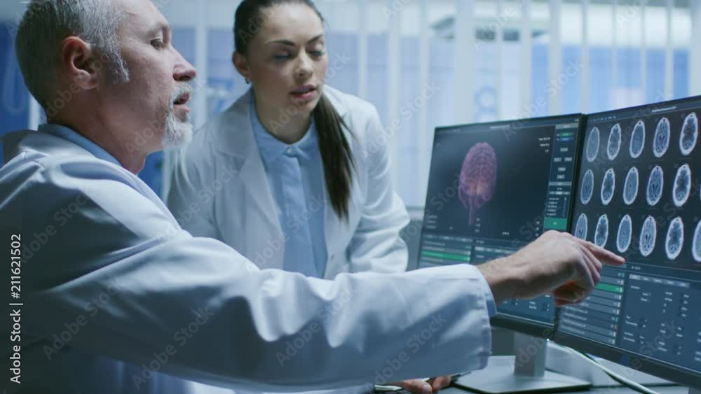 Two Medical Scientists in the Brain Research Laboratory Discussing ...