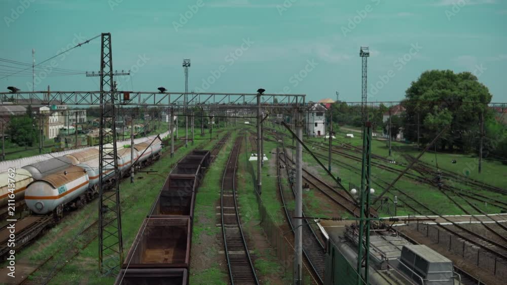 railway tracks, freight train with empty cars, the camera turns, in the ...
