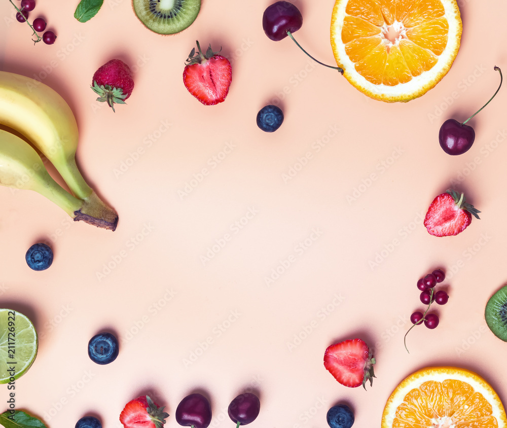 different fruits and berries on the pastel color background. Stock ...
