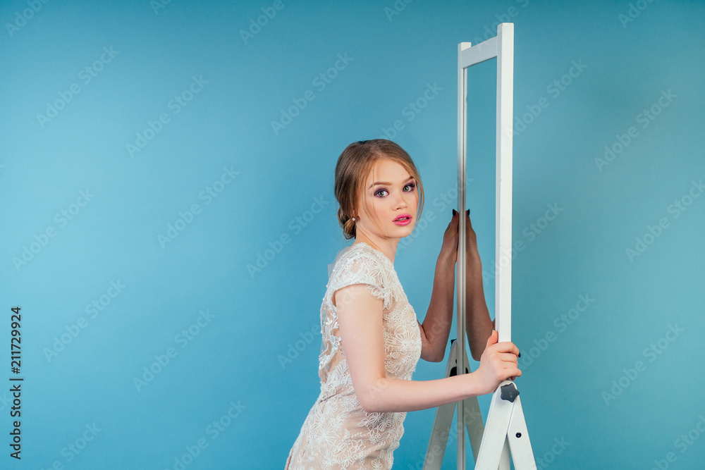 beautiful woman bride with makeup in long chic white wedding dress look ...