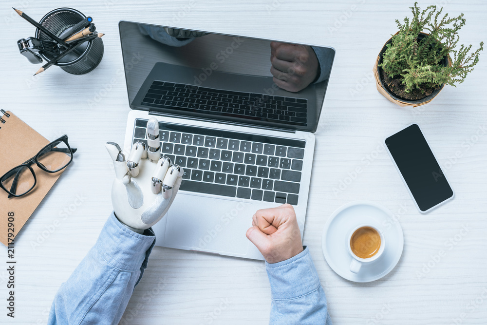 cropped image of businessman with prosthetic arm showing middle finger ...