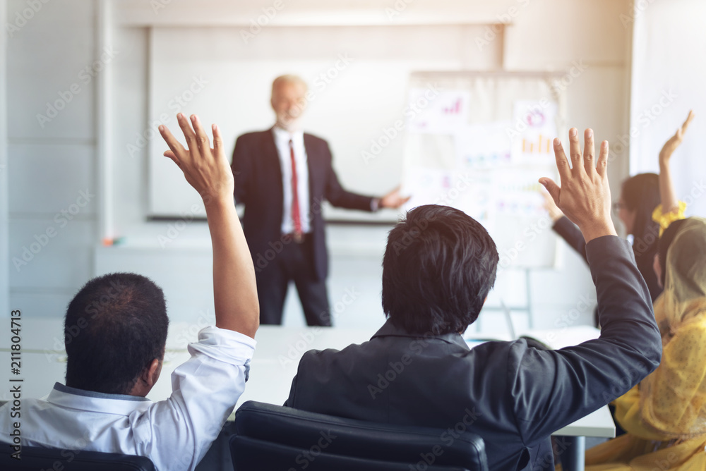 Attendees Business People Show Hand Up for Opinion with Meeting Leader ...