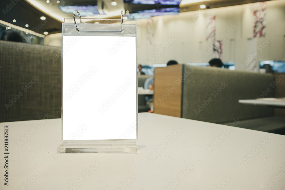 Mockup empty white label menu frame on table with cafe restaurant ...