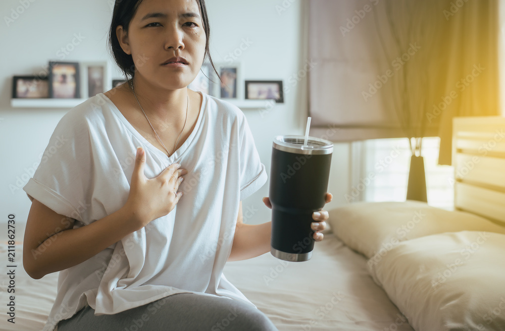 Asian woman having or symptomatic reflux acids,Gastroesophageal reflux ...