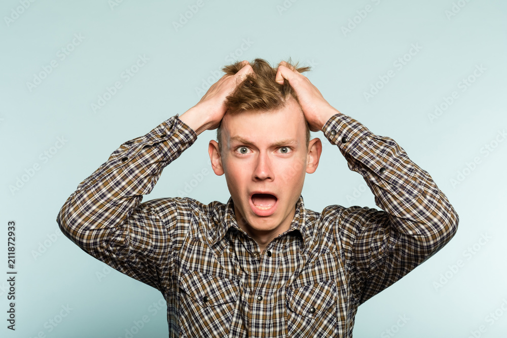 Stockfoto worried shocked distraught disappointed man pulling hair out ...