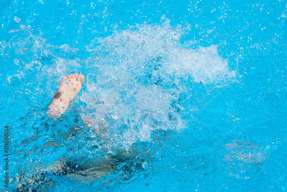 foot of diving drowning child on water surface of summer outdoor ...