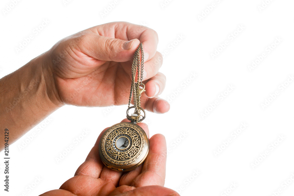 Hand holding a retro styled metal pocket watch in hand on a white ...