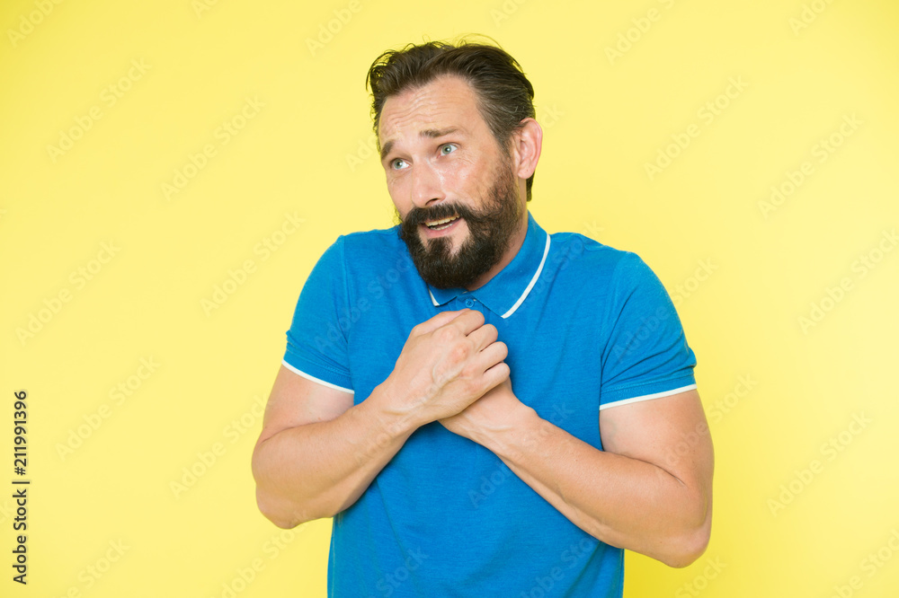 Feel so sorry. Man bearded regretful face, yellow background. Guy ...