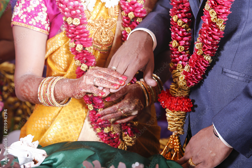 Indian bride and groom holding hands after the wedding ceremony Stock ...