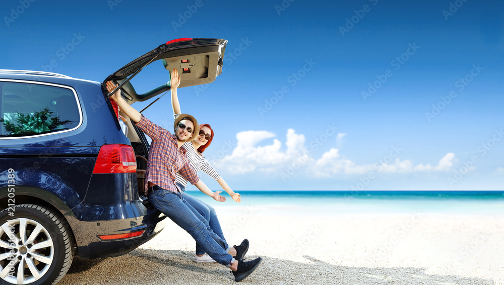 Summer trip on beach. Big blue car with two people. Free space for your ...