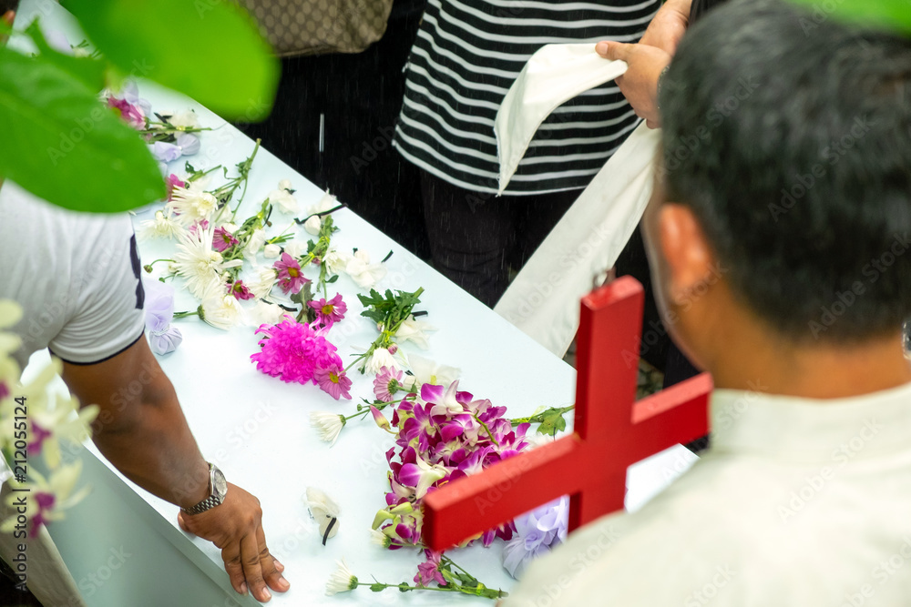 People on funeral Putting Flowers and Earth Soil on Coffin, ASEAN ...
