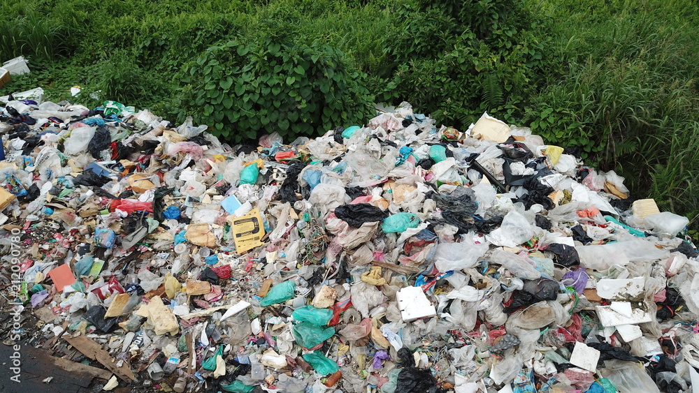 Pollution and poverty. Garbage trash pollutes poor shanty town in ...