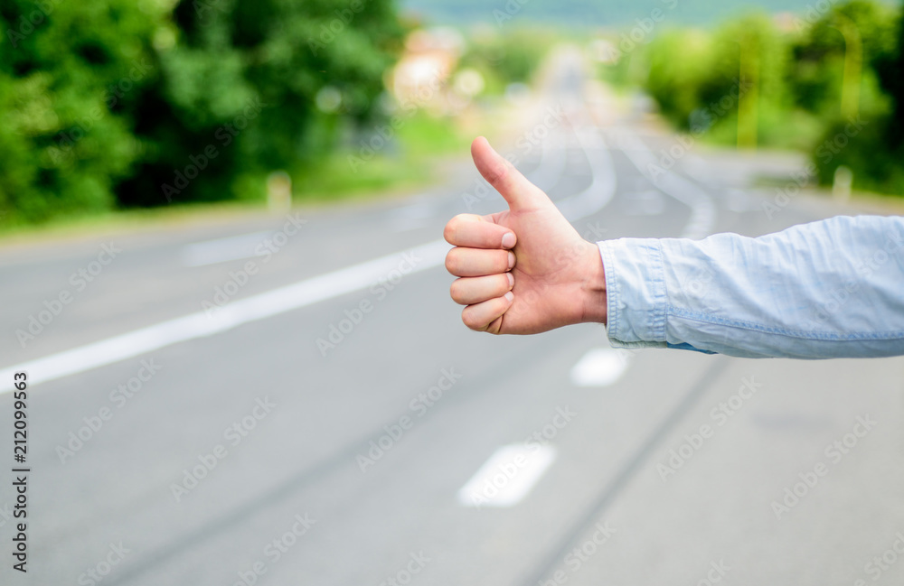 Hand thumb up gesture try stop car road background. Thumb or hand ...