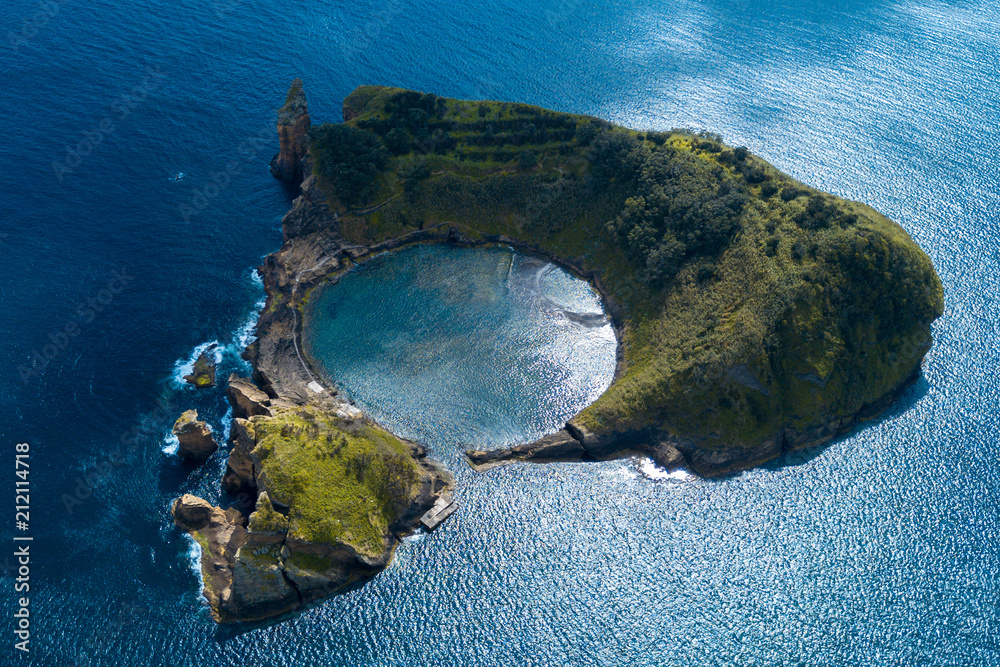 Island with round lagoon in center Stock Photo | Adobe Stock