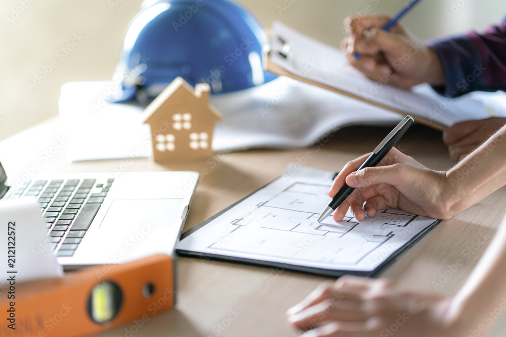 Architect & Engineer working drawing document about project planning ...