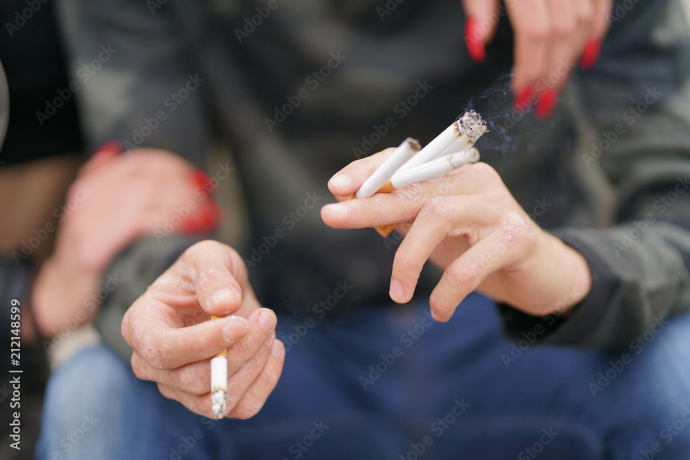 hands with wounds and sores hold a lot of cigarettes close - up Stock ...