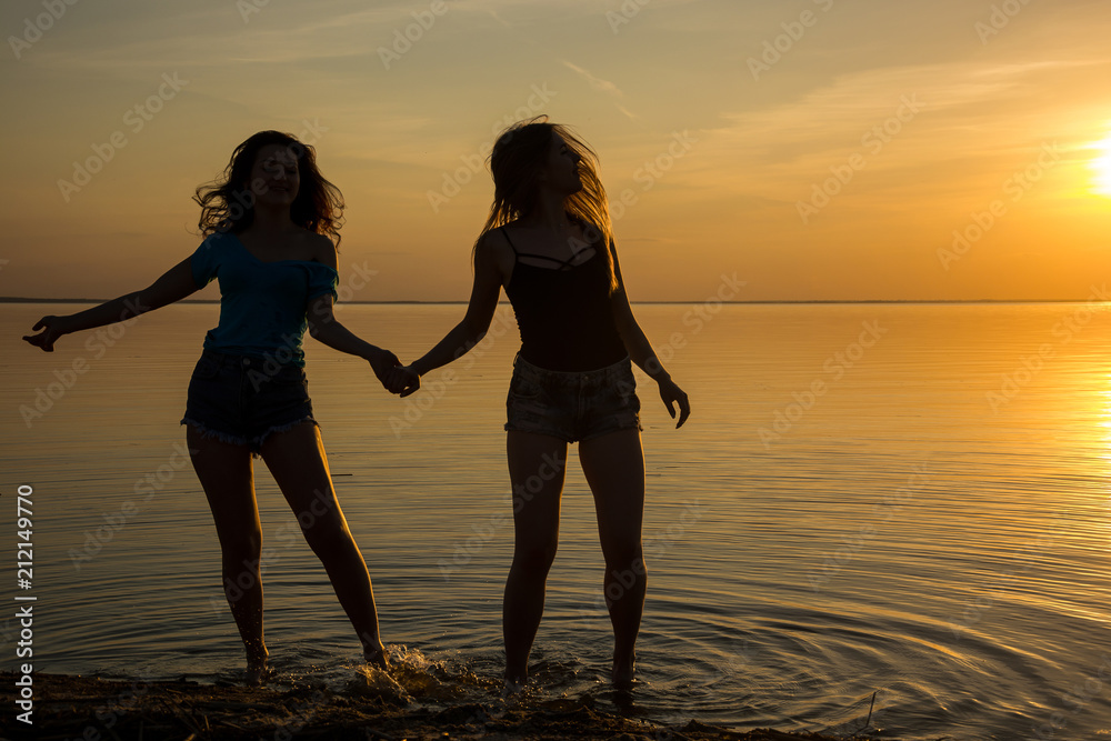 Two Girls In Love Holding Hands