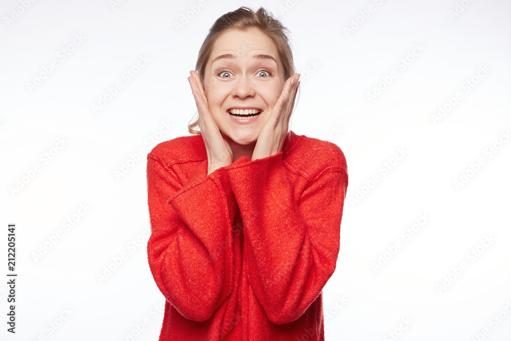 Portrait of excited female model has appealing appearance stares at ...