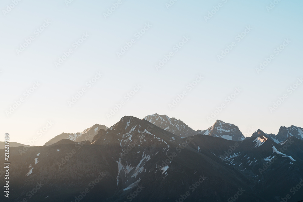fresh and soft mountain morning landscape with snowy rocky peaks and ...